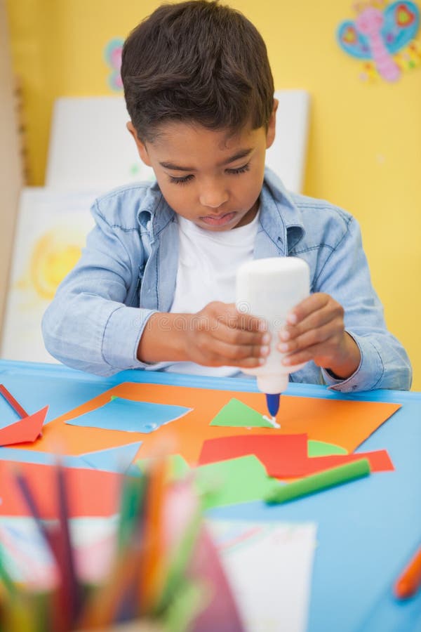 Cute Little Boy Making Art in Classroom Stock Photo - Image of ...