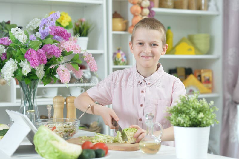 Cute Little Boy Making Dinner Stock Photo - Image of indoors, nutrition ...