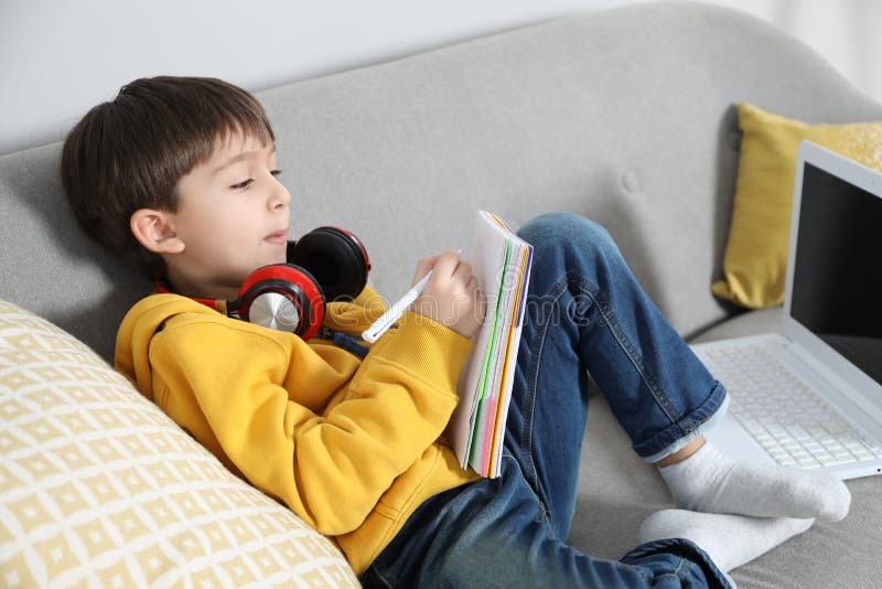 Cute Little Boy with Modern Laptop Studying Online at Home. E-learning ...