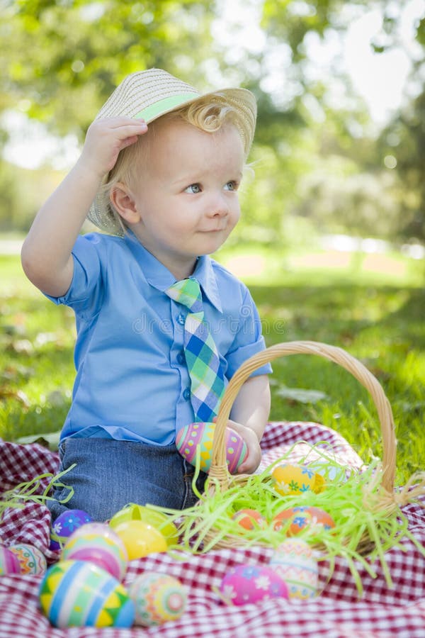 Cute Little Boy Outside Holding Easter Eggs Tips His Hat Stock Photo ...