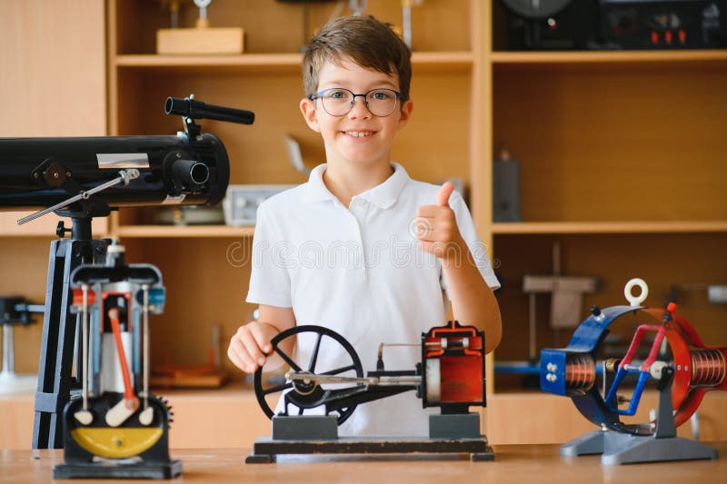 Cute Little Boy at Physics Lesson in Classroom Stock Photo - Image of ...