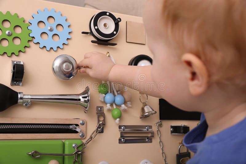 Cute Boy Playing with Busy Board, Focus on Hand Stock Photo - Image of ...