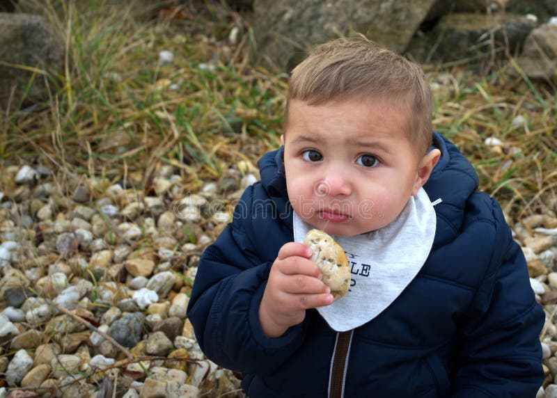 Cute Little Boy Playing Outside with Stones Stock Image - Image of ...