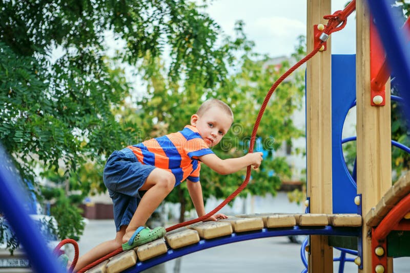 Cute Little Boy Playing on the Playground in the Summer Stock Photo ...