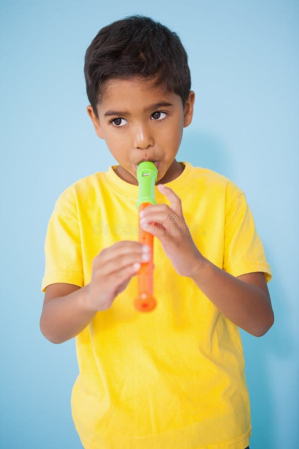 Cute Little Boy Playing the Recorder in Classroom Stock Photo - Image ...