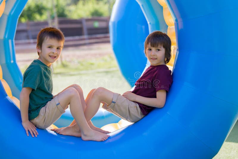 Cute Little Boy, Playing in a Rolling Plastic Cylinder Ring, Full with ...