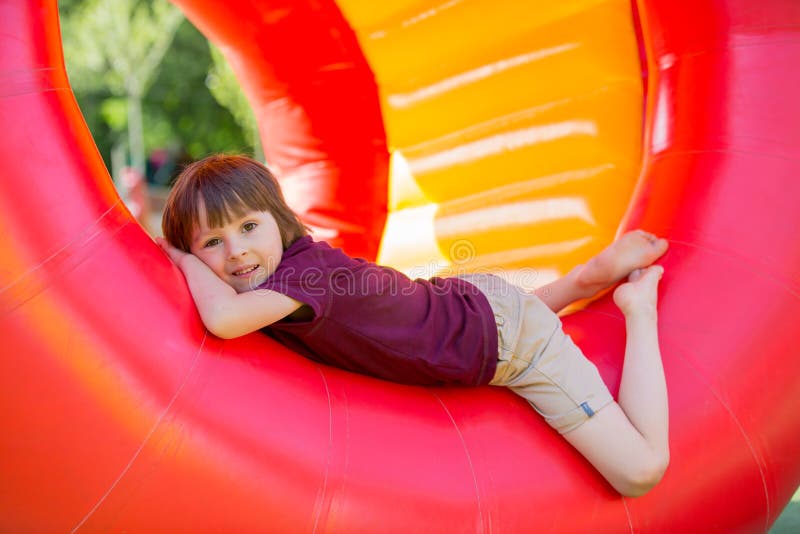 Cute Little Boy, Playing in a Rolling Plastic Cylinder Ring, Full with ...