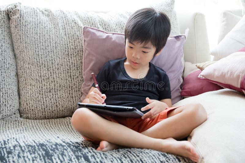 Cute Little Boy Playing Tablet Pc Stock Image - Image of male, home ...