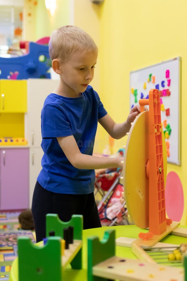 Cute Little Boy Playing with Toys at the Learning Center Stock Photo ...
