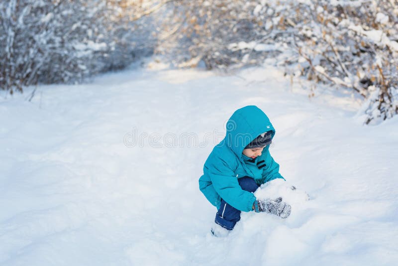 Cute Little Boy Walks in a Snow in the Winter Park Stock Image - Image ...