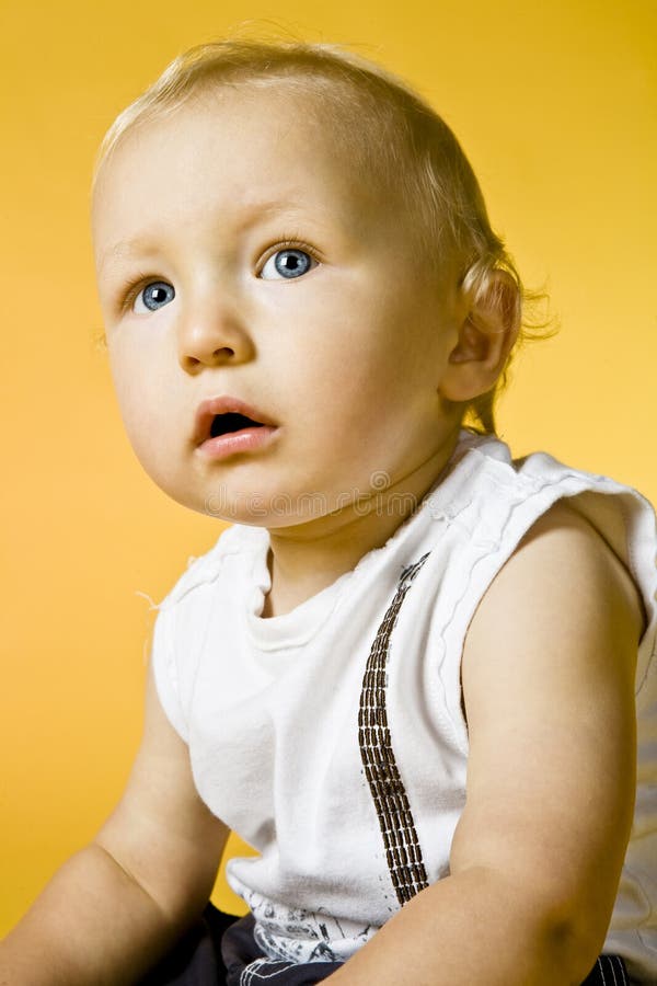 Cute Little Boy Posing on Yellow Background. Stock Photo - Image of ...
