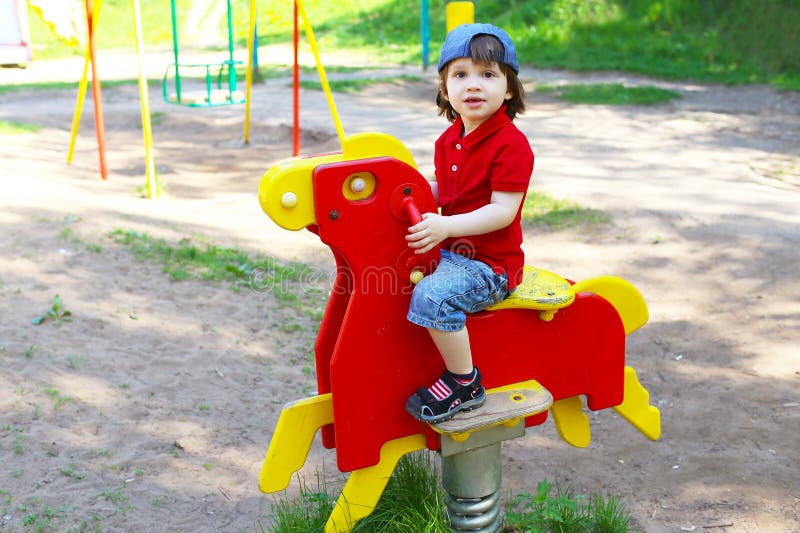 Little Girl and Rocking Horse Stock Image - Image of happy, floor: 6604699