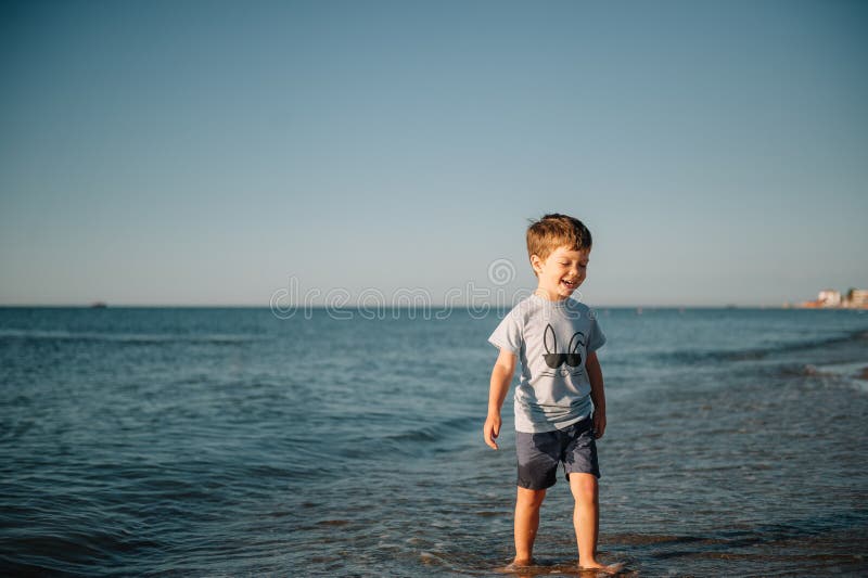 Cute Little Boy Running on Beach and Have Fun. Stock Photo - Image of ...