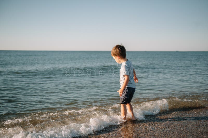 Cute Little Boy Running on Beach and Have Fun. Stock Image - Image of ...