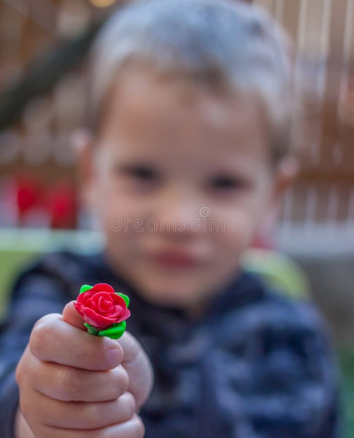 Cute Little Boy Showing Rose Made of Plasticine Stock Photo - Image of ...