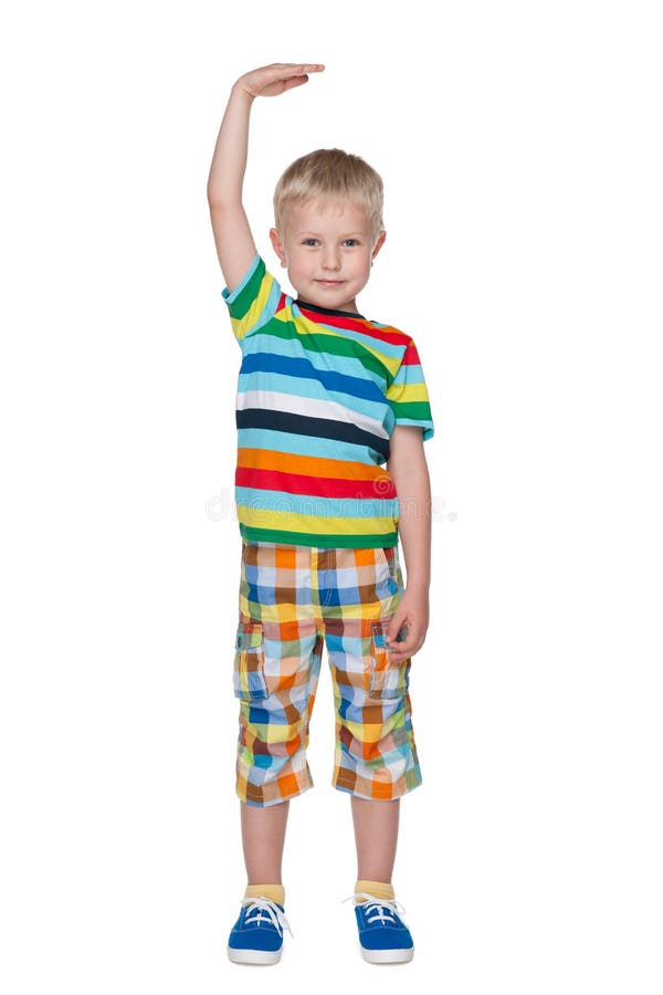 A Cute Little Boy Shows How he is Tall Stock Photo - Image of little ...