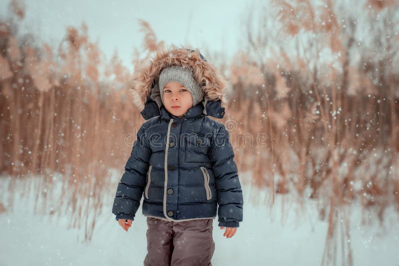 Cute Little Boy on a Snowy Field. Stock Image - Image of lifestyle ...
