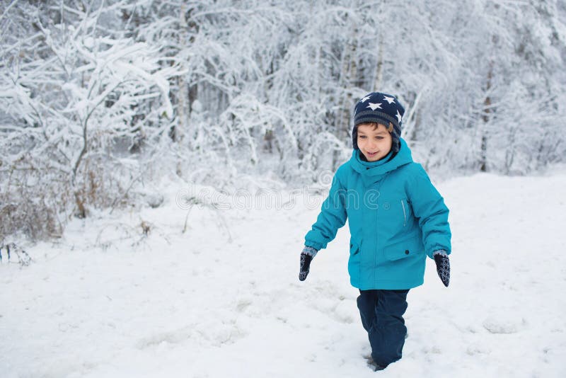 Cute Little Boy Walks in a Snow in the Winter Park Stock Image - Image ...