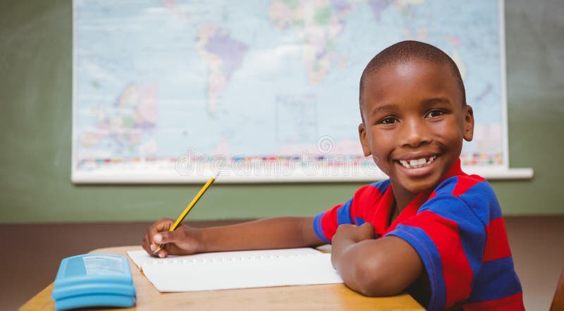 Cute Little Boy Writing Book in Classroom Stock Image - Image of ...