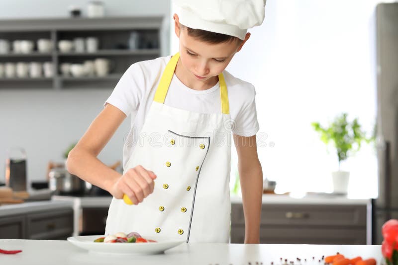 Cute Little Chef Dressing Salad in Kitchen Stock Photo - Image of meal ...
