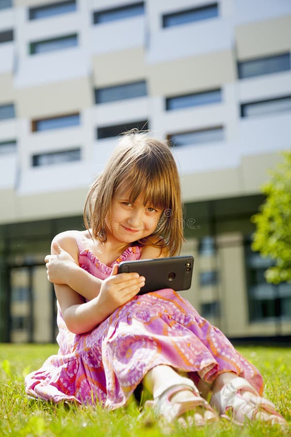 Cute Little Child Girl Using Smartphone and Learnig Remote Distance ...