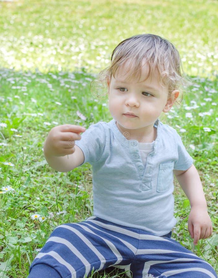 Cute Little Child Standing on the Grass in the Park Stock Photo - Image ...