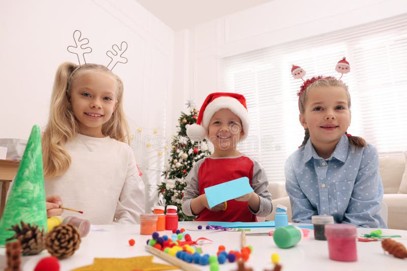 Cute Little Children Making Christmas Crafts at Table in Room Stock ...