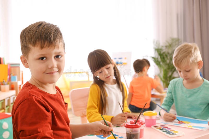 Cute Little Children Painting at Table Stock Photo - Image of bright ...