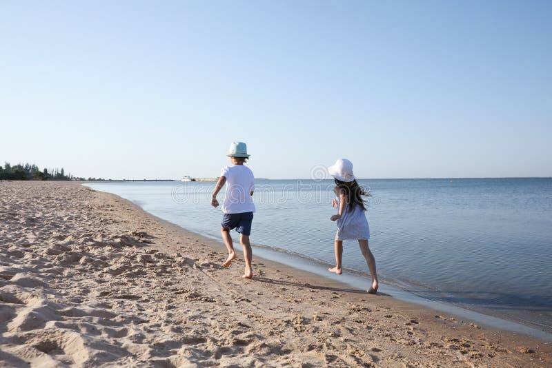 Cute Little Children Running at Sandy Beach on Day Stock Photo - Image ...