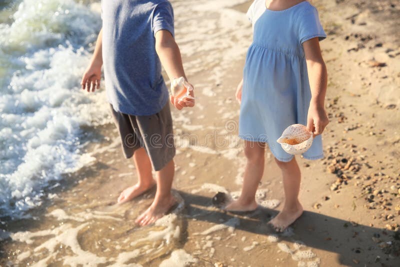 Cute Little Children with Sea Shells on Beach Stock Photo - Image of ...