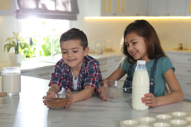 Cute Children at Table with Cooking Ingredients in Kitchen Stock Image ...