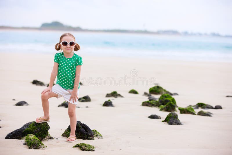 Cute little girl at beach stock image. Image of water - 28944897