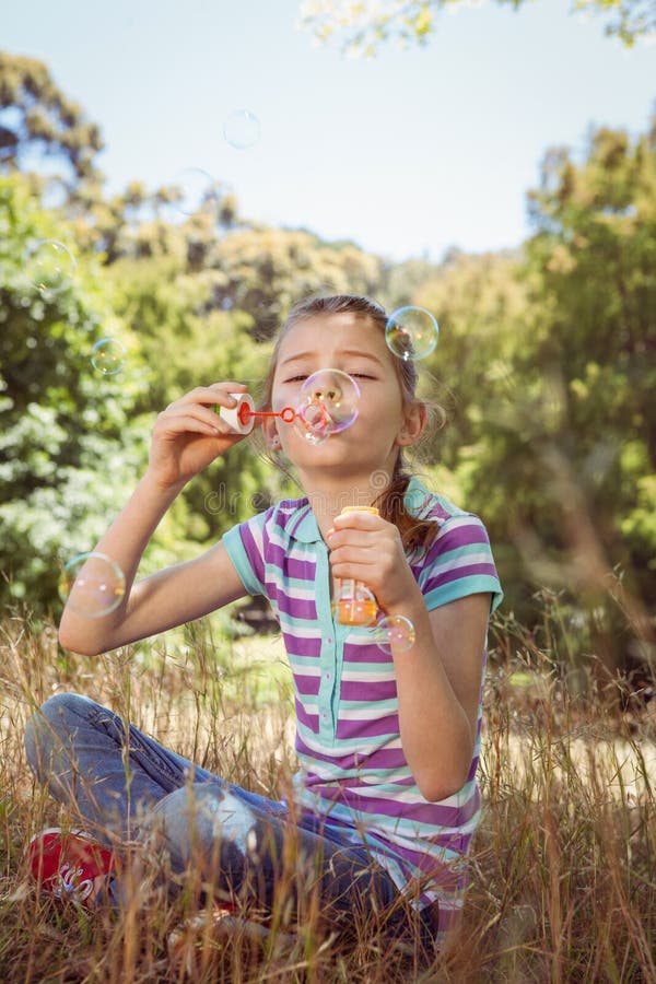 Cute Little Girl Blowing Bubbles Stock Photo - Image of summertime ...
