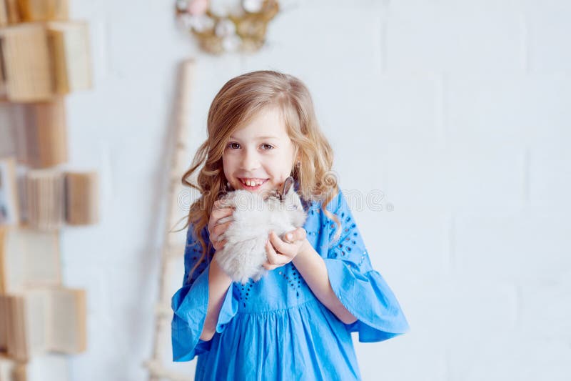 Cute Little Girl with a Bunny Rabbit Has Easter Stock Photo - Image of ...