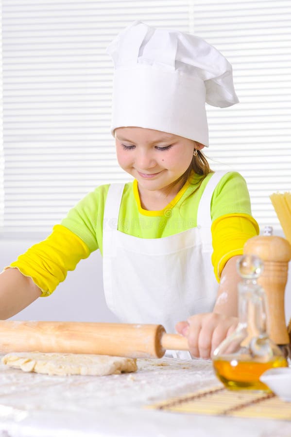 Cute Little Girl in Chef`s Hat Baking Cake in the Kitchen Stock Photo ...