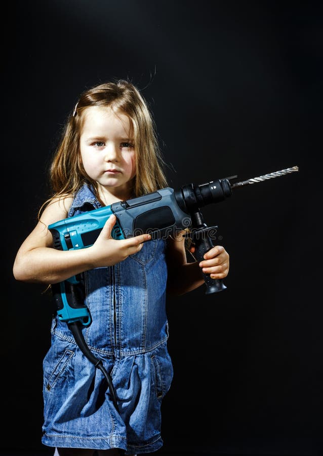 Cute Little Girl with Drilling Machine in Her Hands Stock Image - Image ...