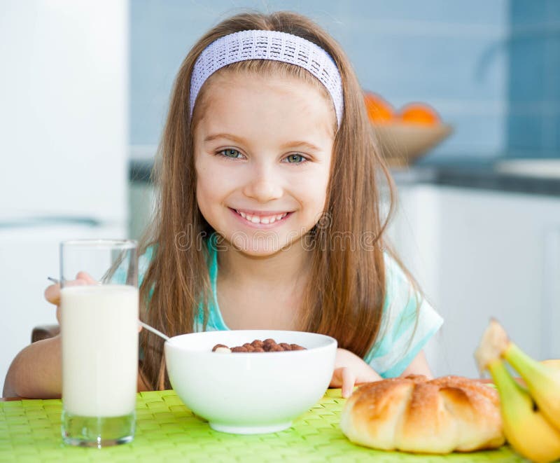 Little Girl Eating Her Breakfast Stock Image - Image of drink ...