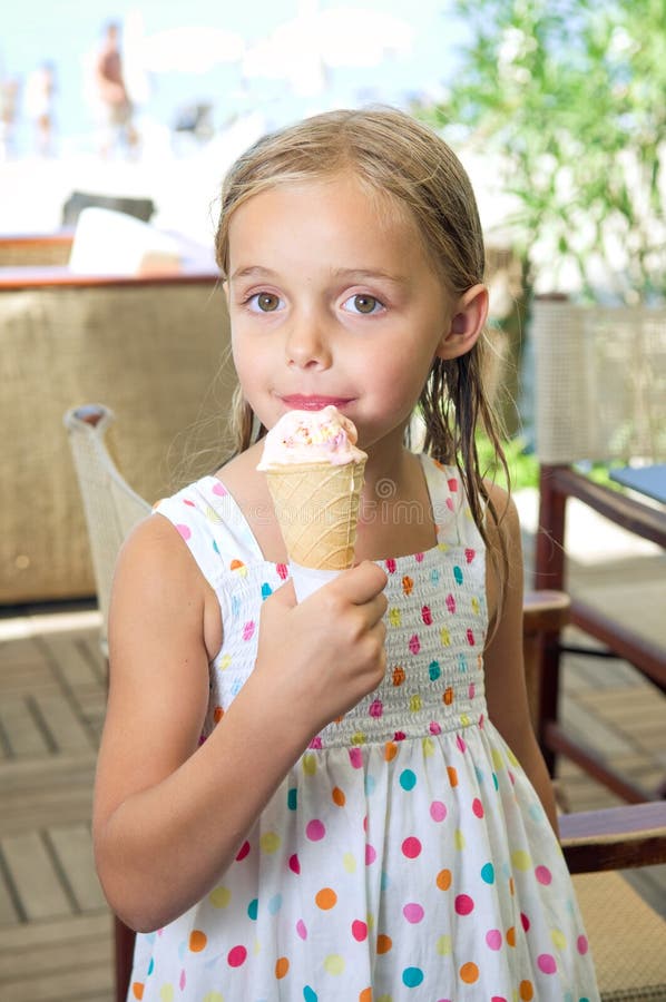 Cute Brunette Little Girl Eating Ice Cream Stock Photo - Image of alone ...