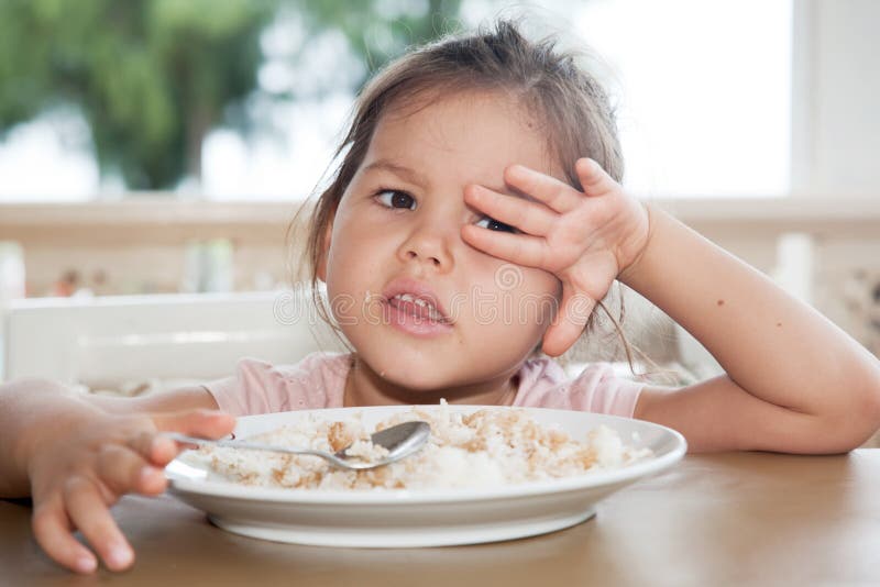Cute Little Girl Eats Rice in a Summer Cafe Stock Image - Image of meal ...