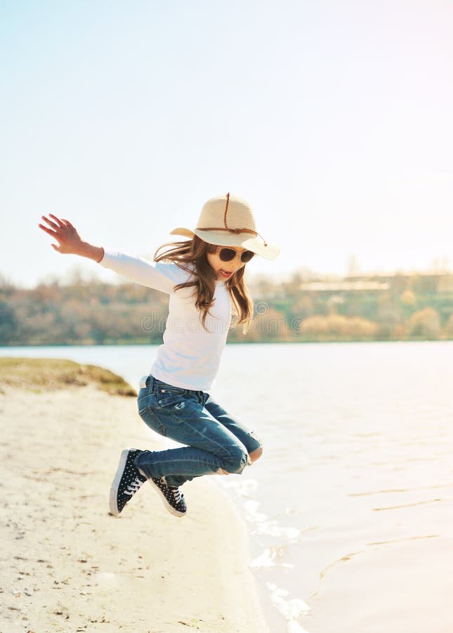 Cute Little Girl Has a Fun on the Beach. Stock Image - Image of leisure ...