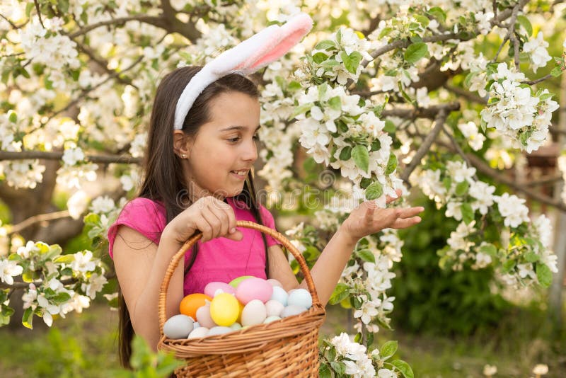 Cute Little Girl Looking for Easter Eggs. Stock Photo - Image of easter ...
