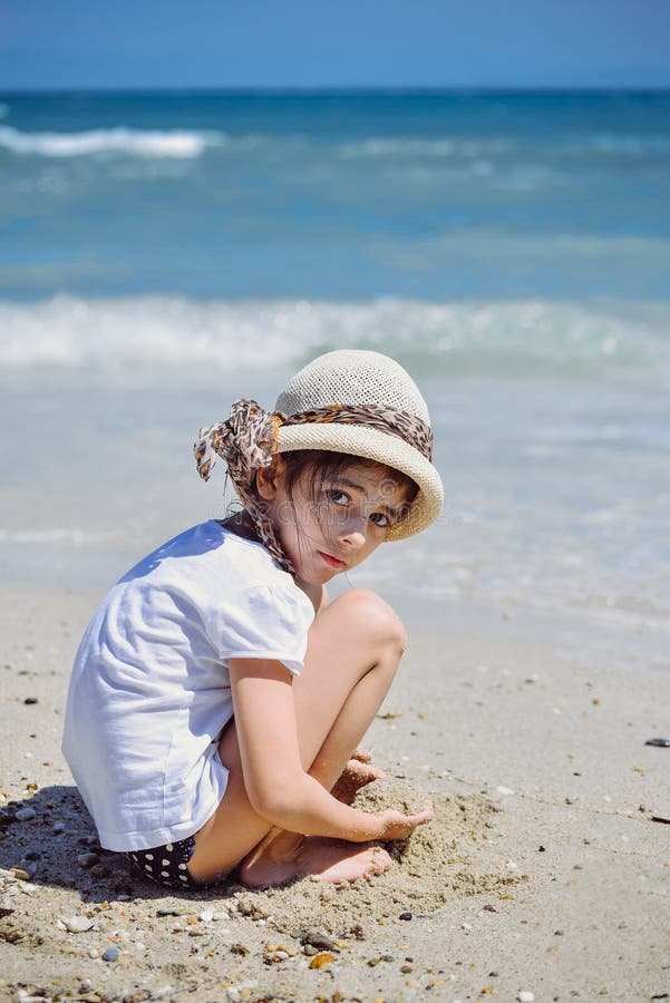Cute Little Girl Playing on the Beach Stock Image - Image of girl ...