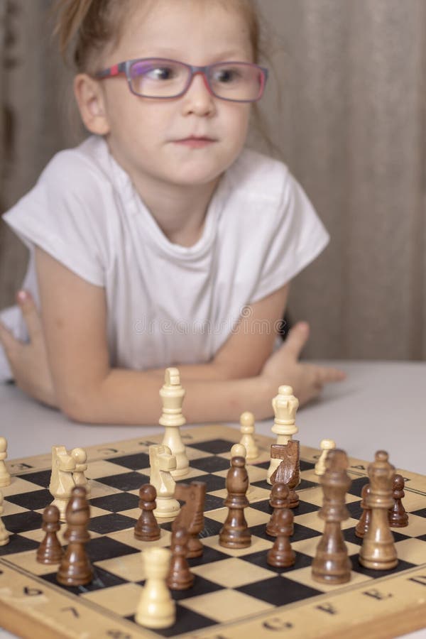 Cute Little Girl Playing Chess at Home Stock Image - Image of casual ...