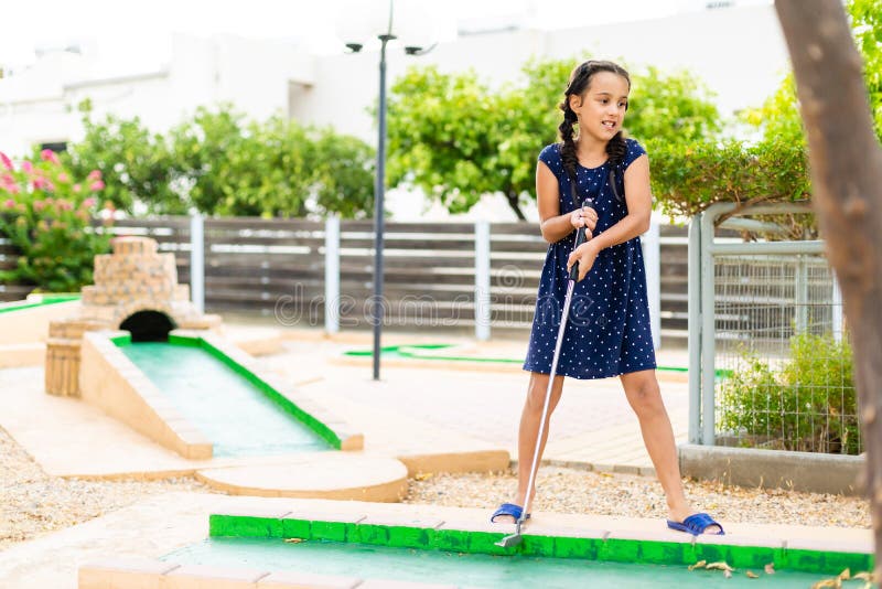 Cute Little Girl Playing Mini Golf in a Park Stock Image - Image of ...