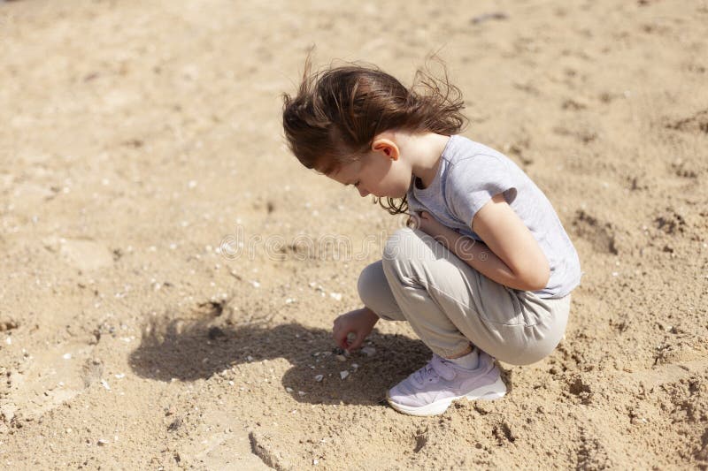 Cute Little Girl Playing with Sand on the Beach in Summer Stock Image ...