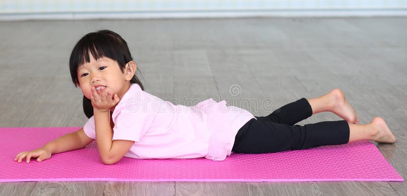 Cute Little Girl Practicing Yoga and Doing Exercise Stock Photo - Image ...