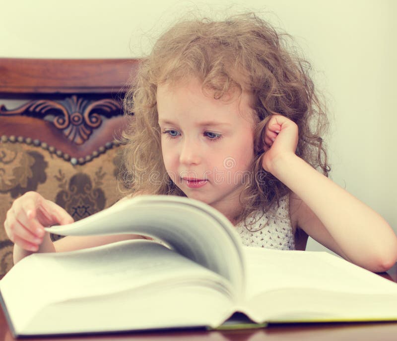 Cute little girl reading stock photo. Image of girl, lovely - 32318004