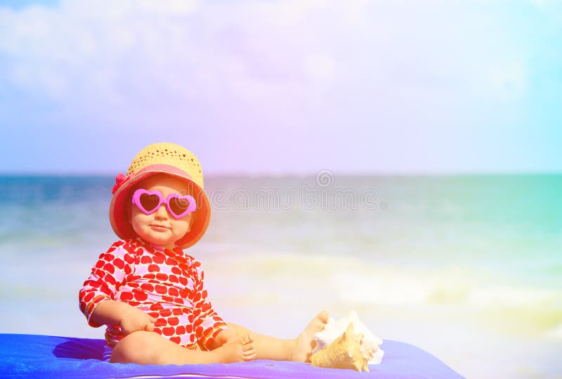 Cute Little Girl with Seashells on the Beach Stock Photo - Image of ...