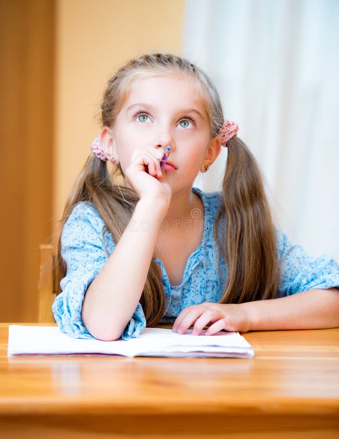 Cute little girl studying stock photo. Image of hand - 50749574