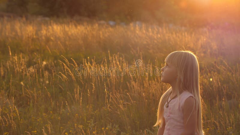 Happy Little Girl at Sunset Stock Video - Video of dream, rest: 97400095